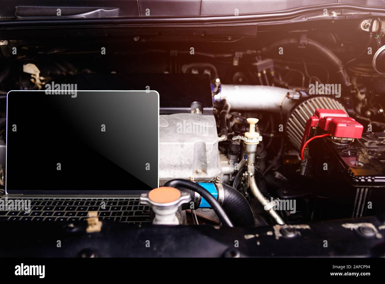 Laptop computer on car mechanic engine for service at workshop Stock ...