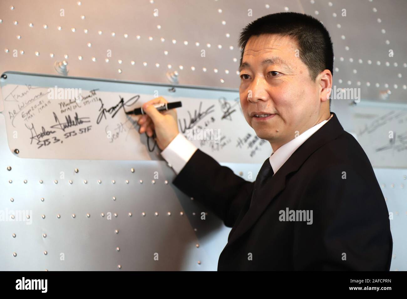 Tokyo, Japan. 14th Dec, 2019. China's first astronaut Yang Liwei puts ...
