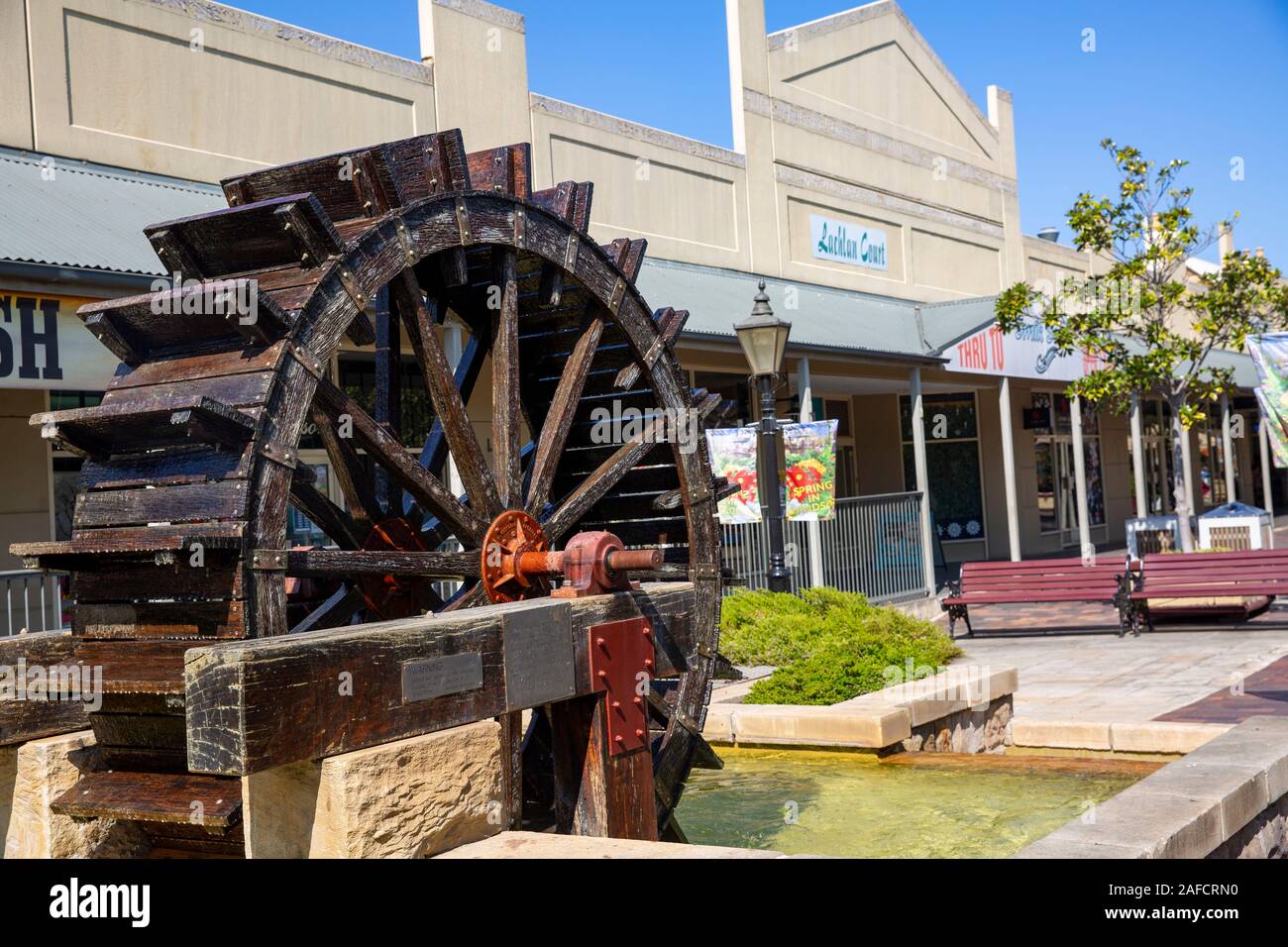 Windsor town centre in New South Wales and traditional water wheel ...