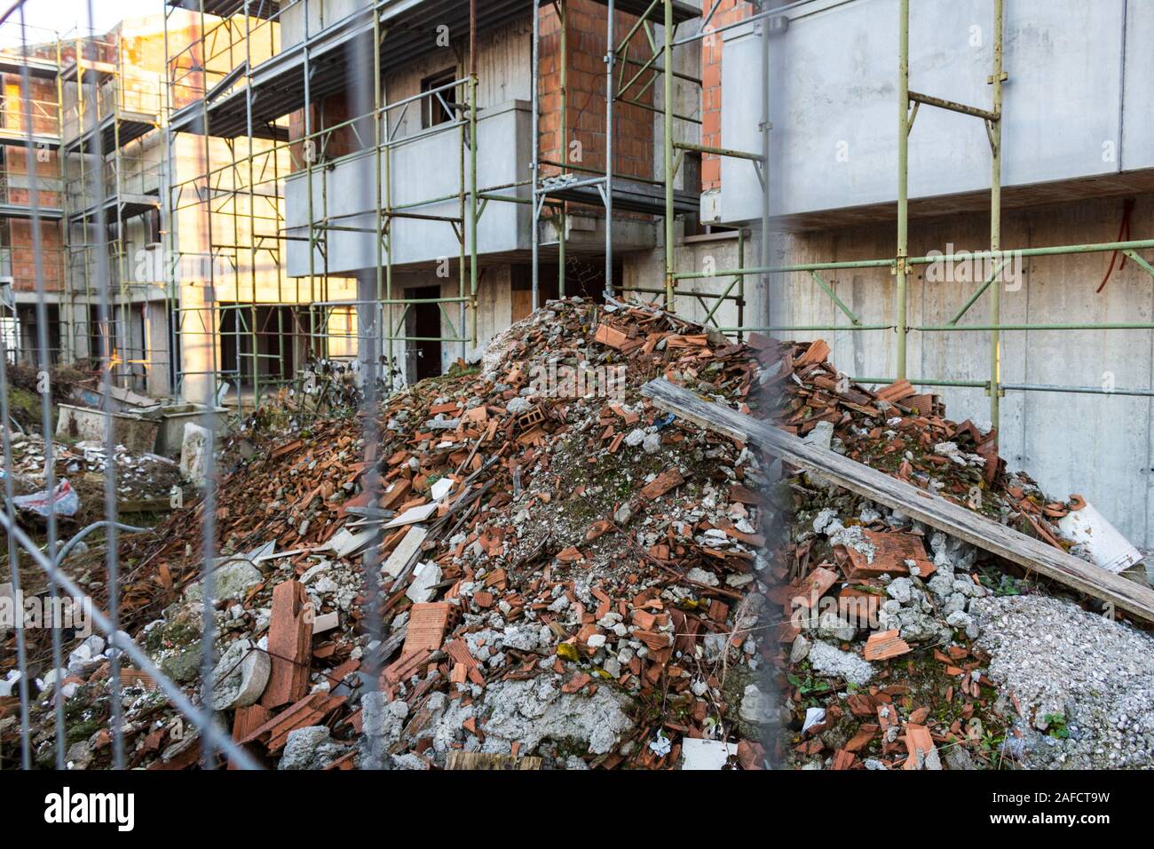 waste material of a construction site and scaffolding assembled Stock ...
