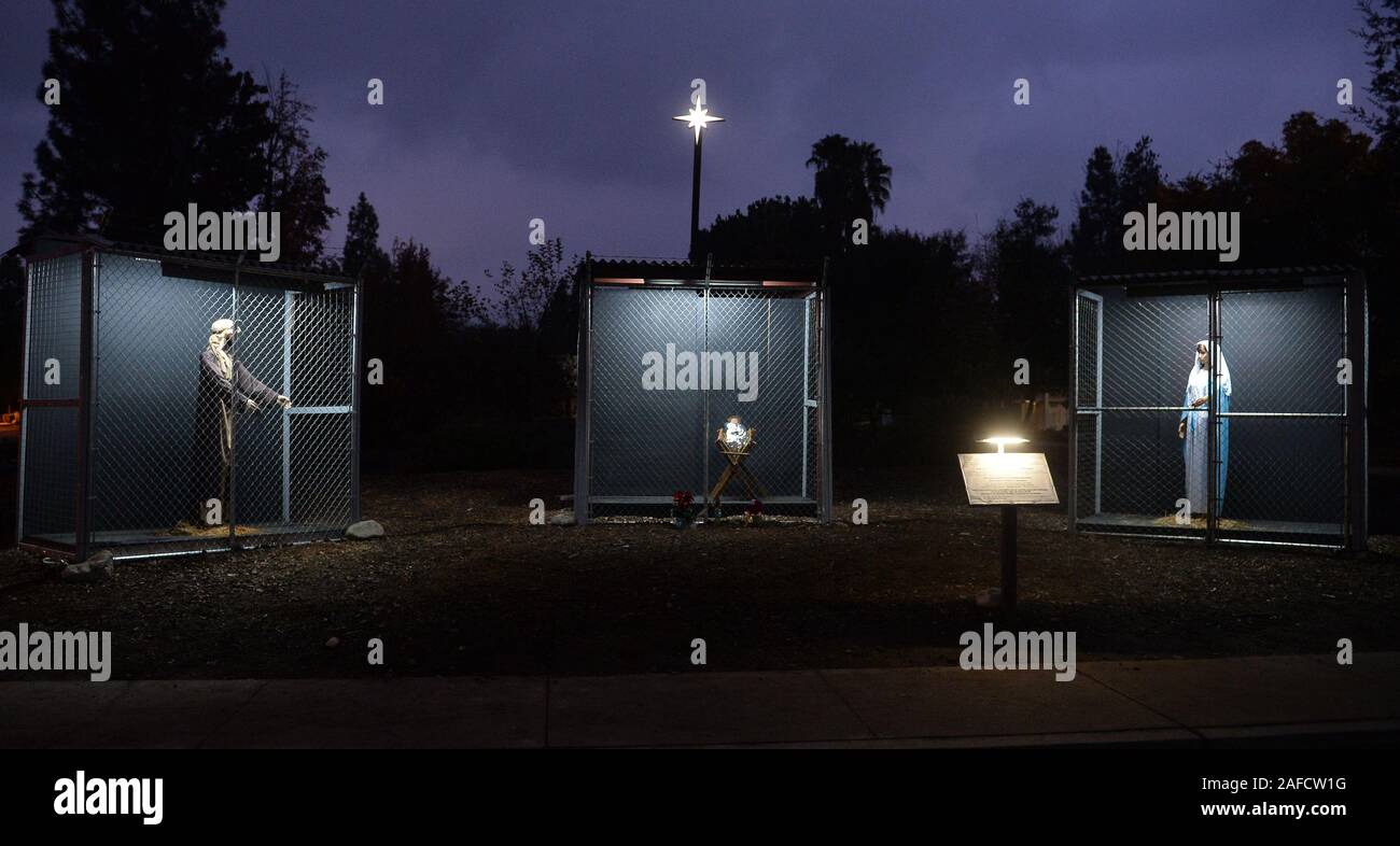 A Nativity scene depicting Jesus, Mary and Joseph as refugees in cages ...