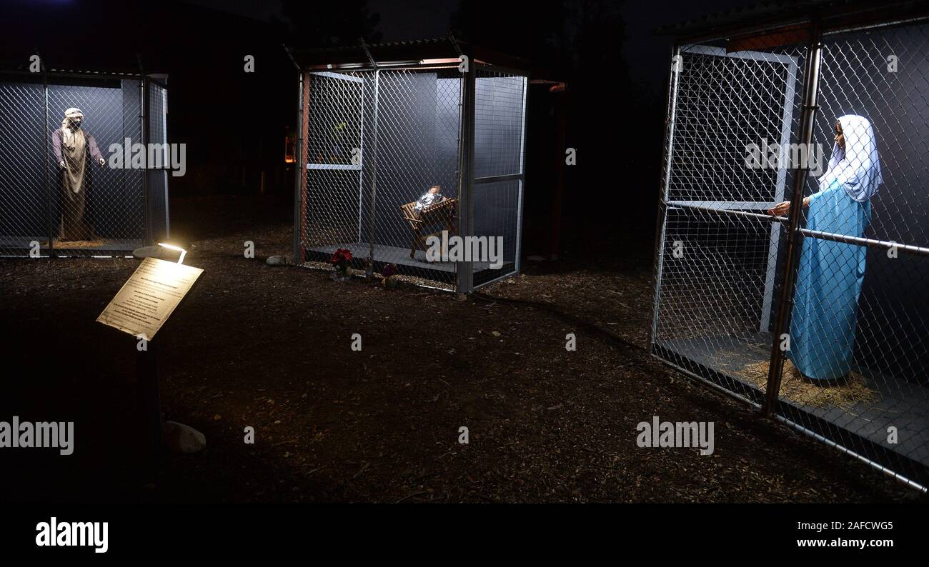 A Nativity scene depicting Jesus, Mary and Joseph as refugees in cages ...