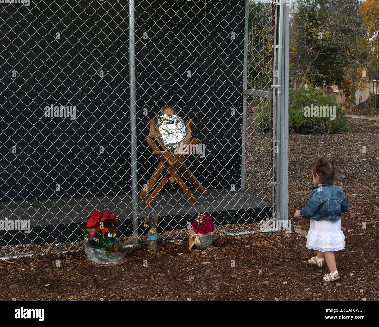 A Nativity scene depicting Jesus, Mary and Joseph as refugees in cages ...