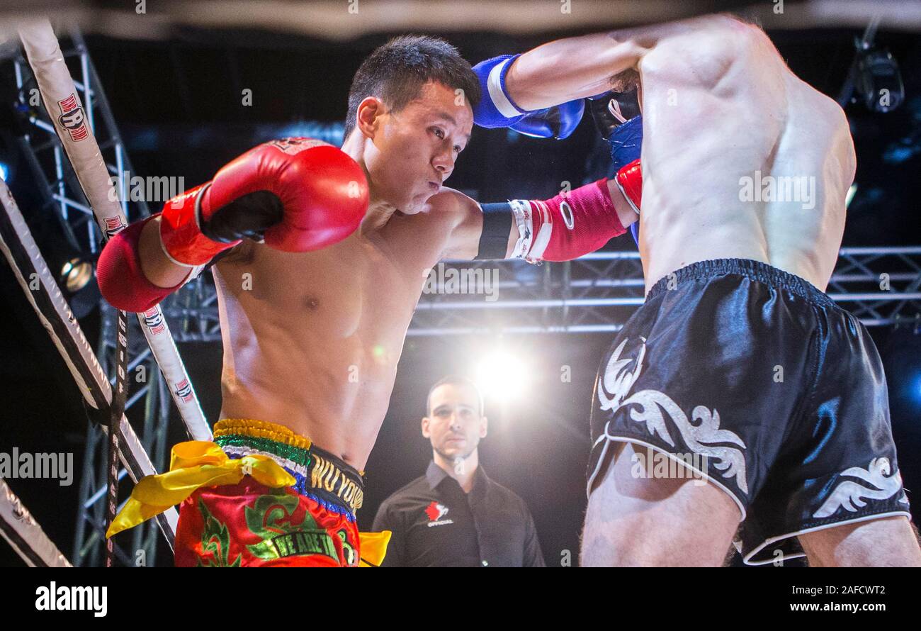 Markham, Canada. 14th Dec, 2019. Yang Ming (L) of China fights against ...