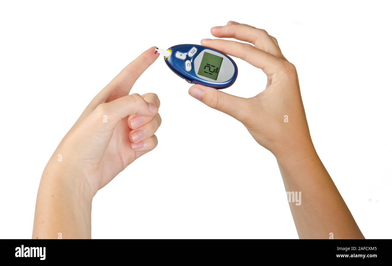 Diabetes testing with blood glucose meter Cut Out Stock Images ...