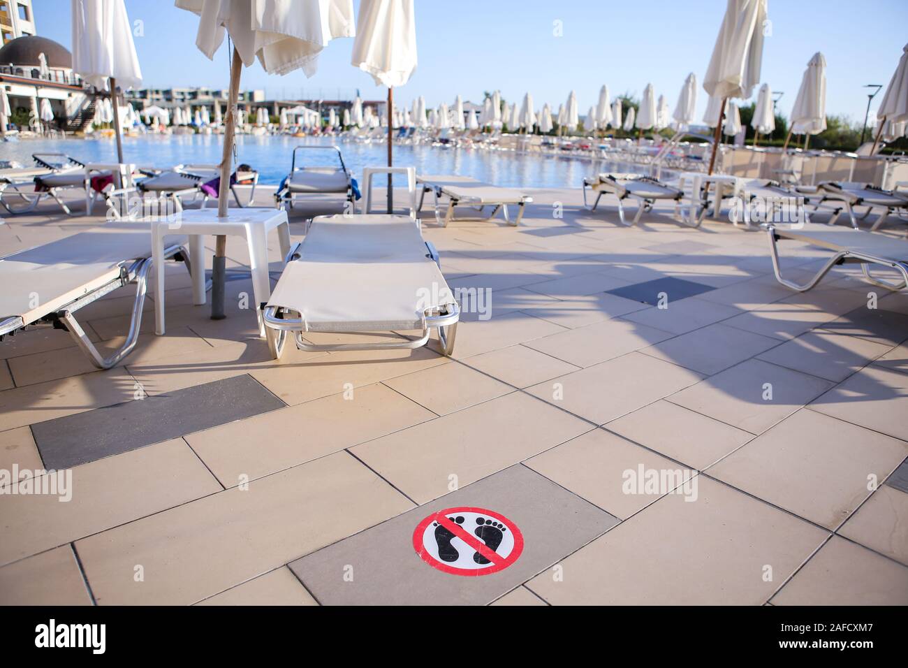 No walking or running barefoot sign on a hotel swimming pool Stock ...