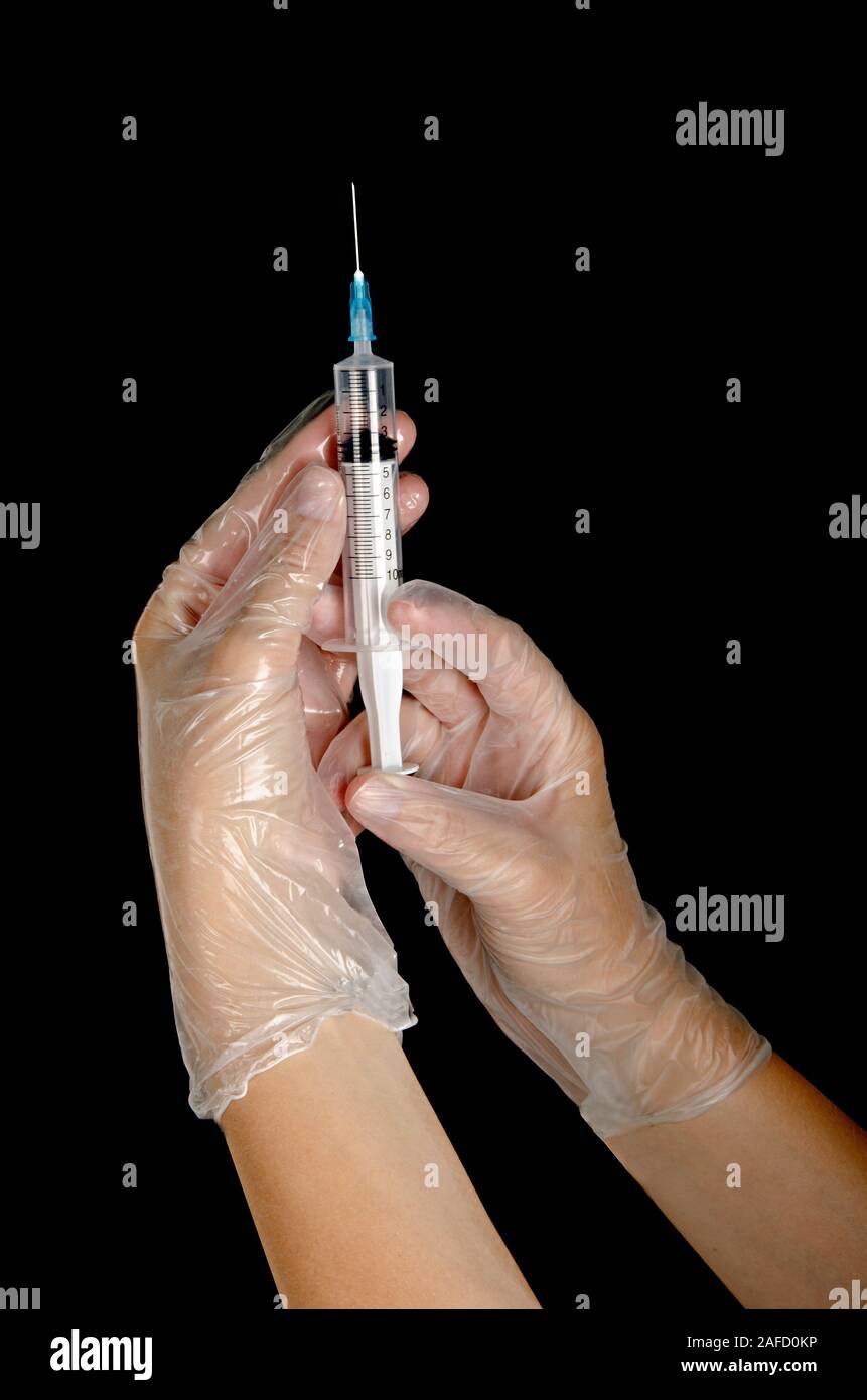 Hand with syringe Stock Photo - Alamy