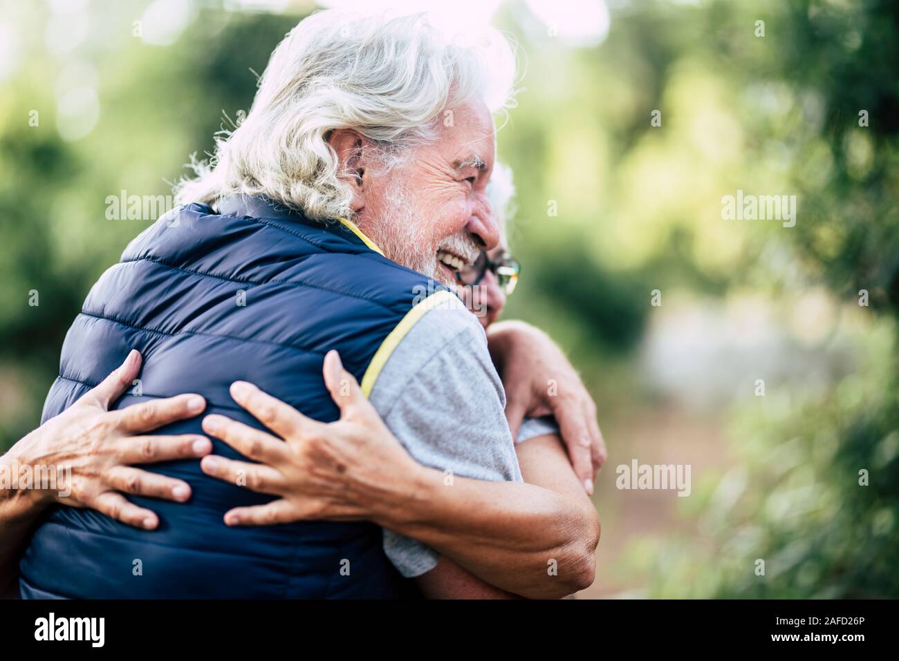 Old people senior cacuasian couple hug with love and friendship in ...