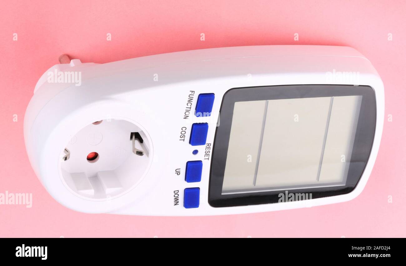 Digital Power Meter on pink background Stock Photo - Alamy