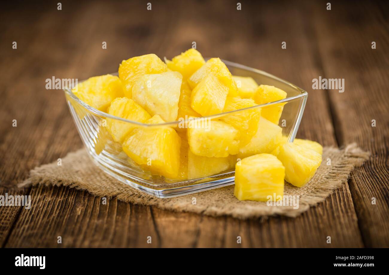 Fresh made Pineapple (sliced) on a vintage background as detailed close ...