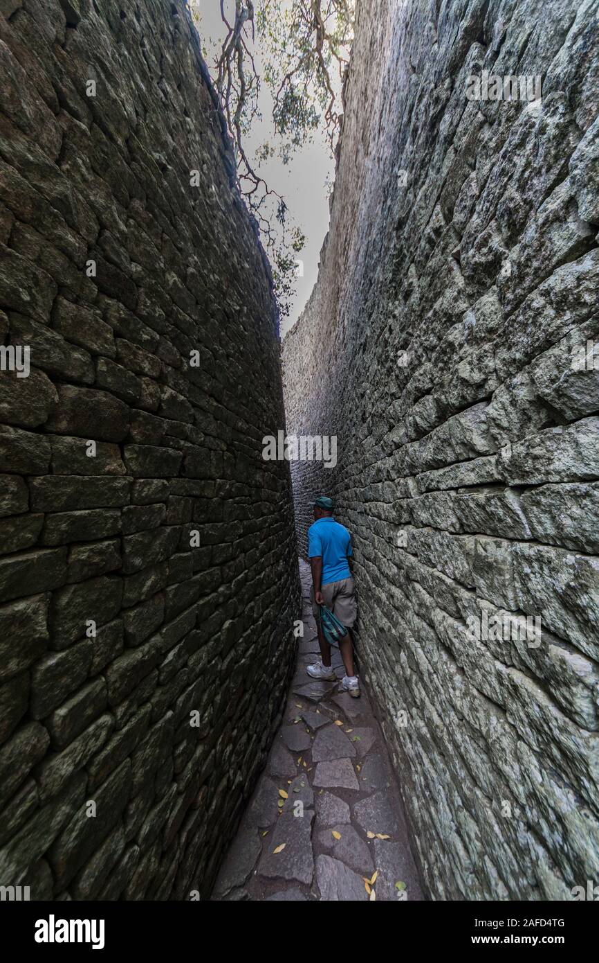 Great Zimbabwe Ruins, Masvingo, Zimbabwe. A man walks between the walls ...