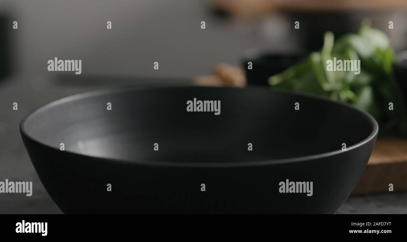 empty black bowl for salad on kitchen countertop, wide photo Stock ...