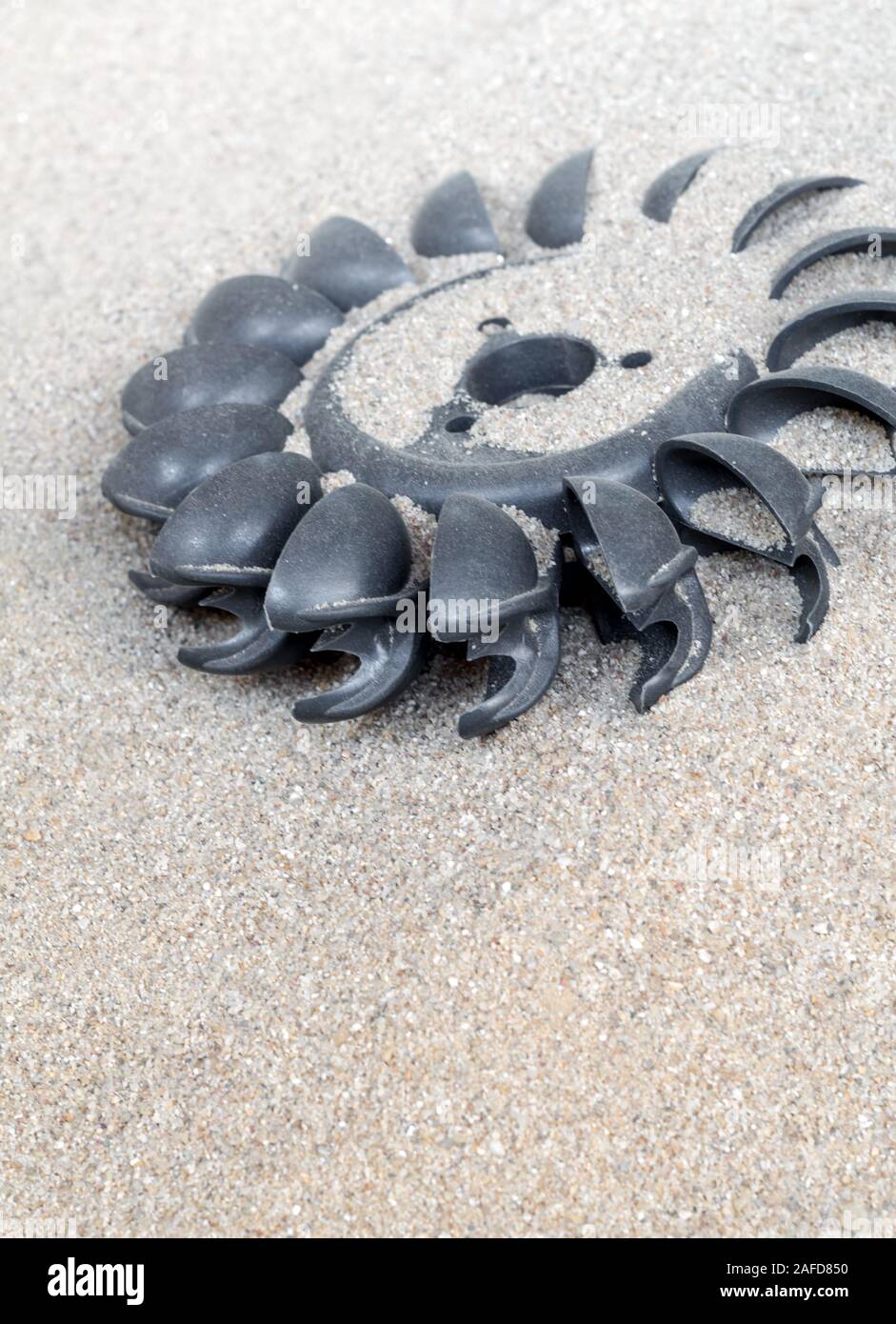 Old water turbine on dried sand without water, useless in drought ...