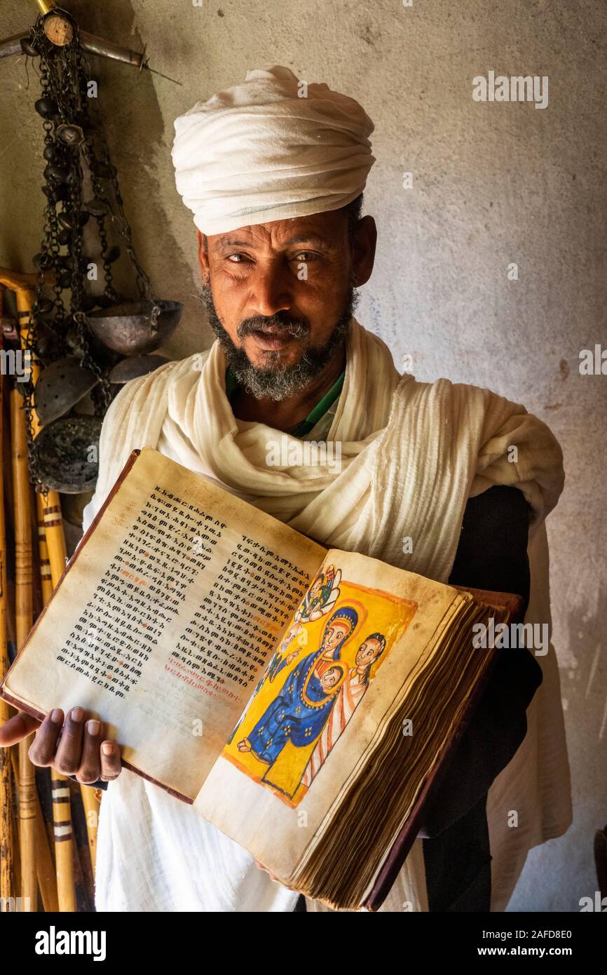 Ethiopia, Tigray, Adwa, Yeha, priest displaying Nativity page of ...