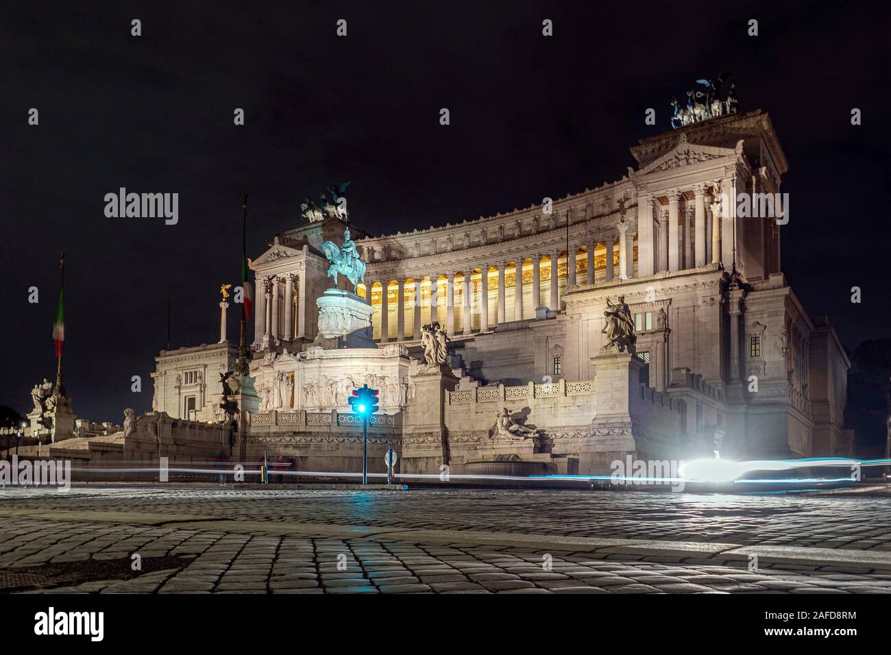 Rome unknow soldier vittoriano palace night view with car lights trail ...