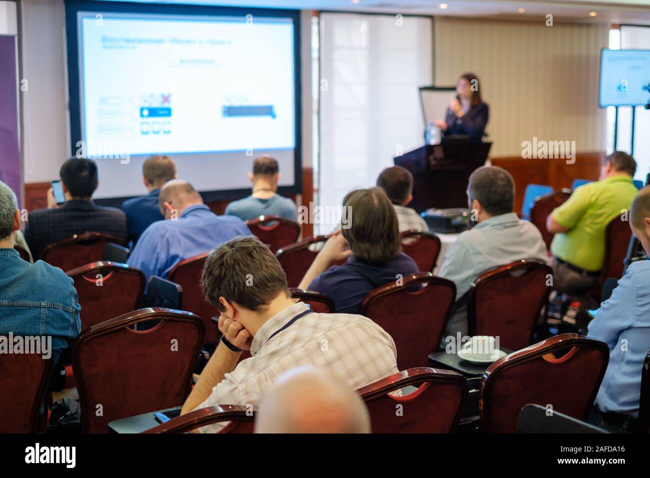 Audience listens lecturer at workshop Stock Photo - Alamy