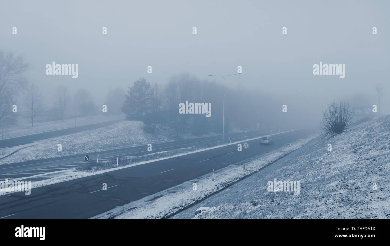 Cars in the fog. Bad winter weather and dangerous automobile traffic on ...