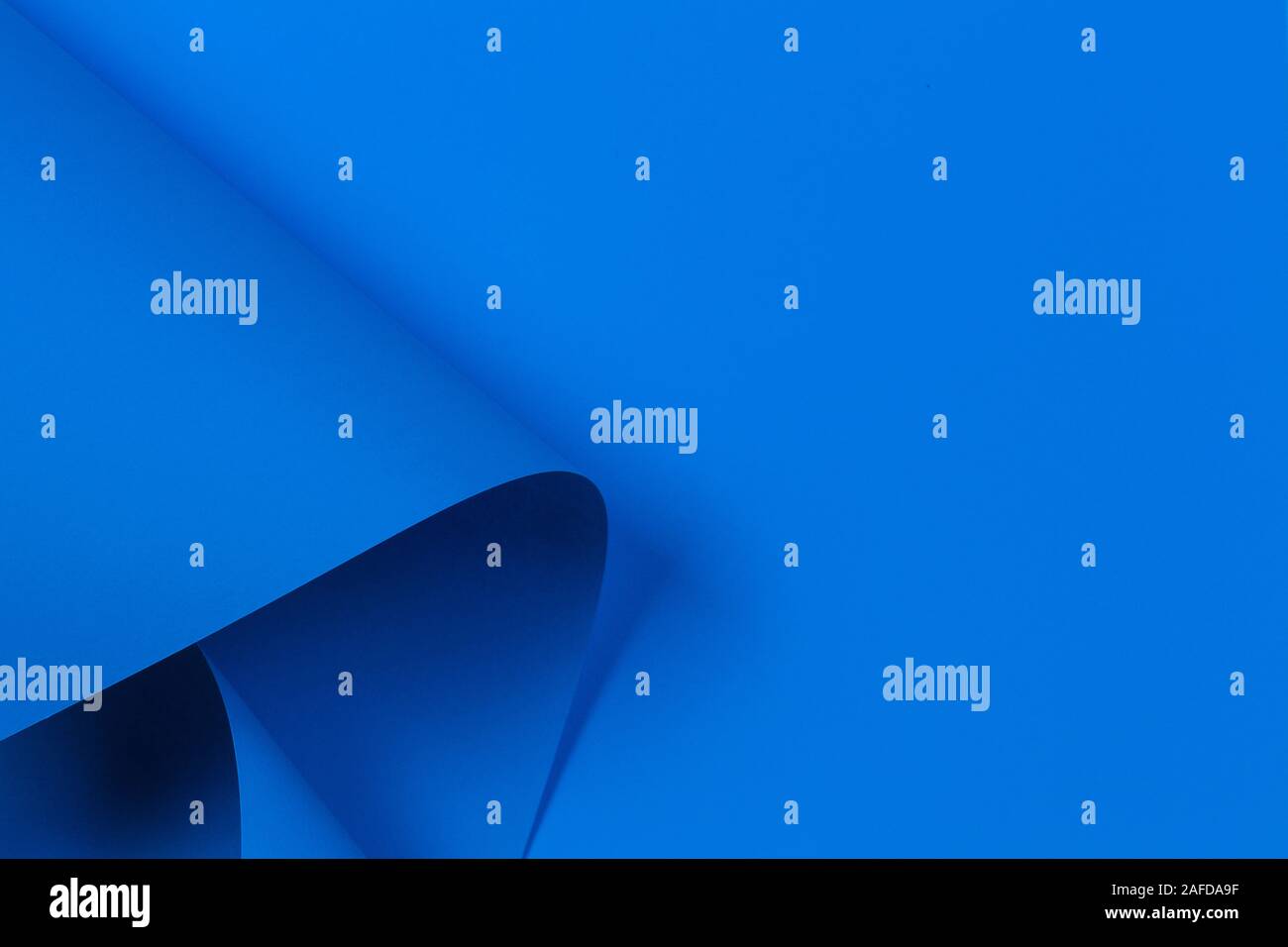 Abstract geometric shape blue color paper background Stock Photo - Alamy