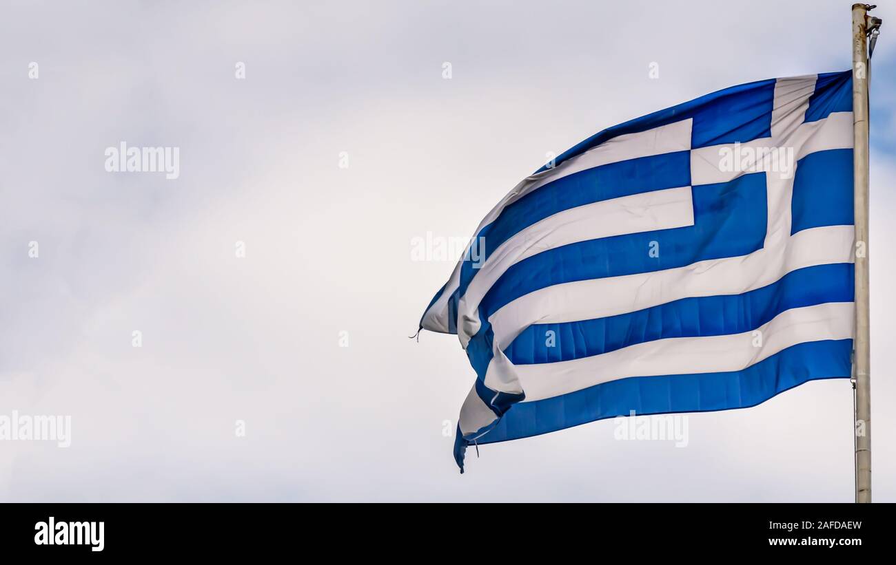 Greek national flag waving on blue sky background. Hellenic Republic ...