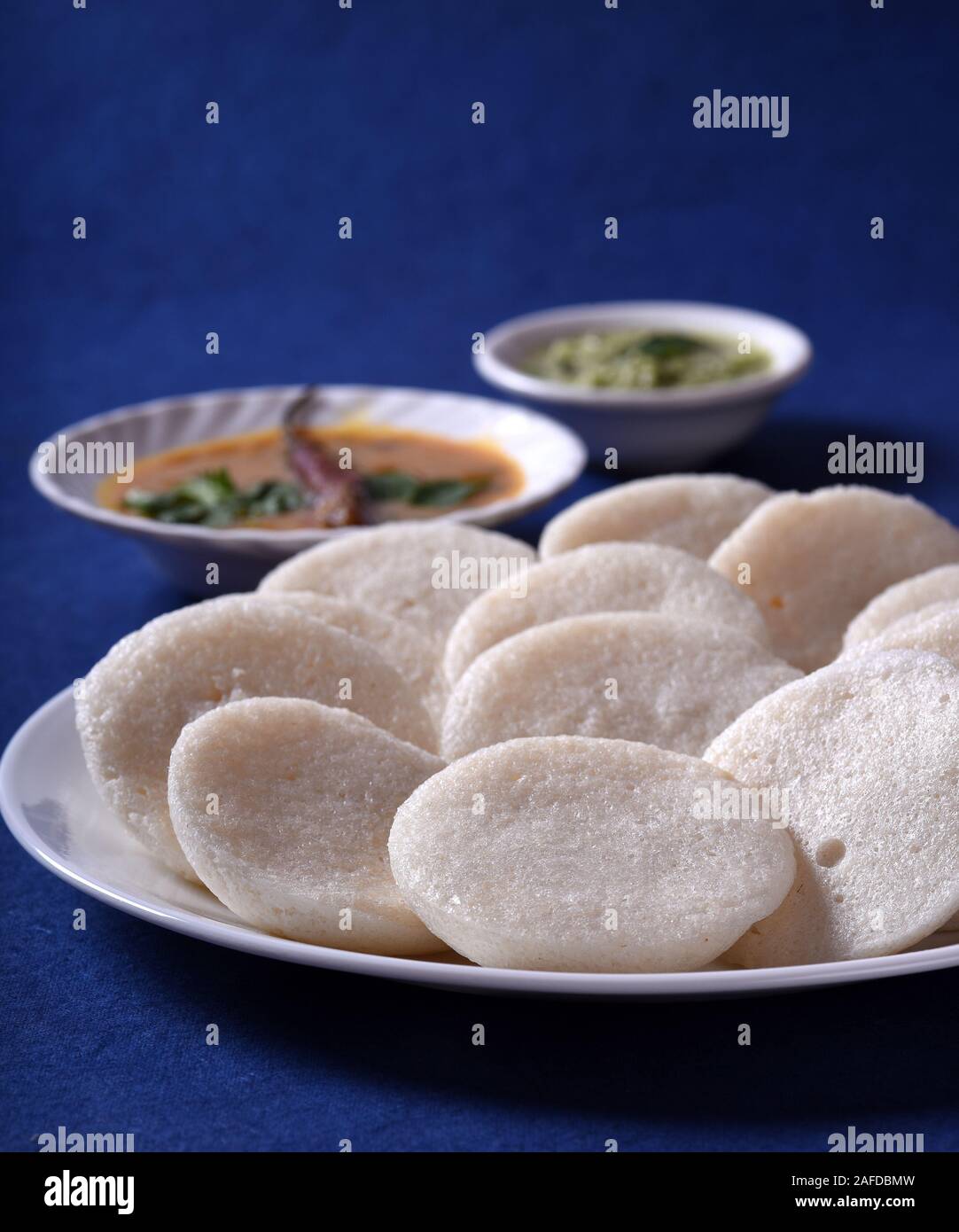 Idli with Sambar and coconut chutney on blue background, Indian Dish ...