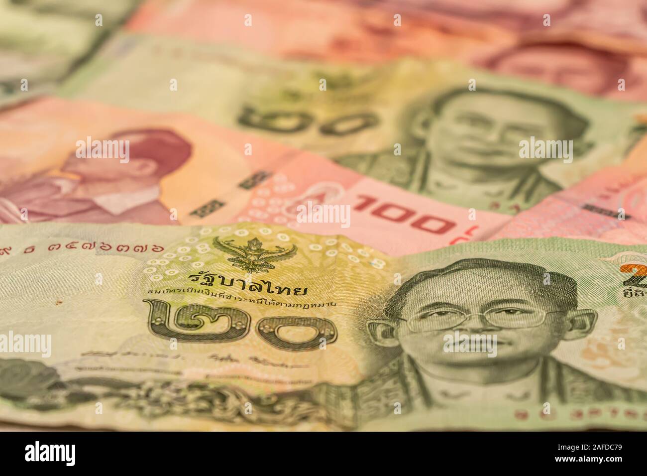 A composition of Thai baht. THB banknotes providing great options to be ...