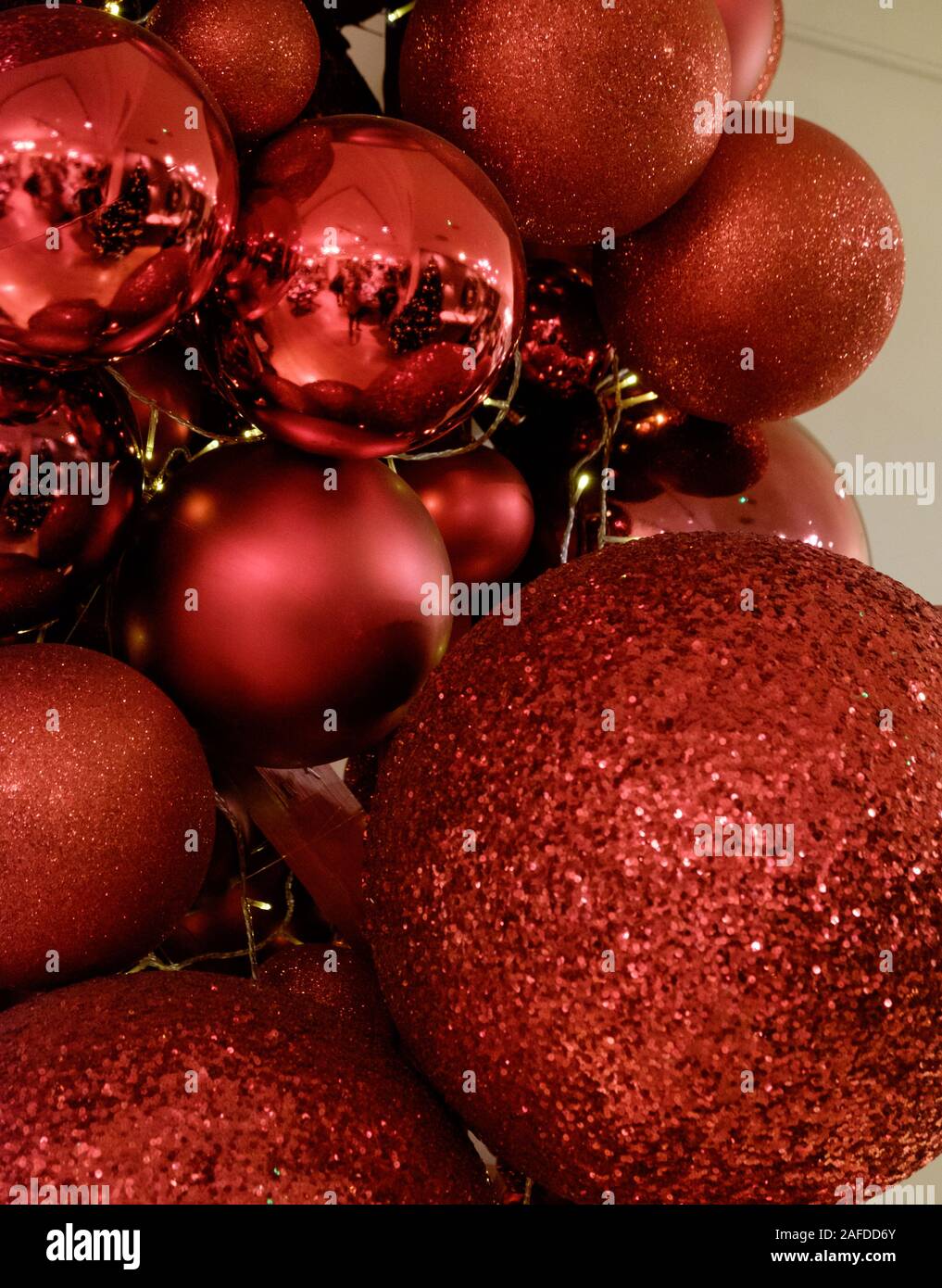 Close up of red Christmas baubles on a tree Stock Photo - Alamy
