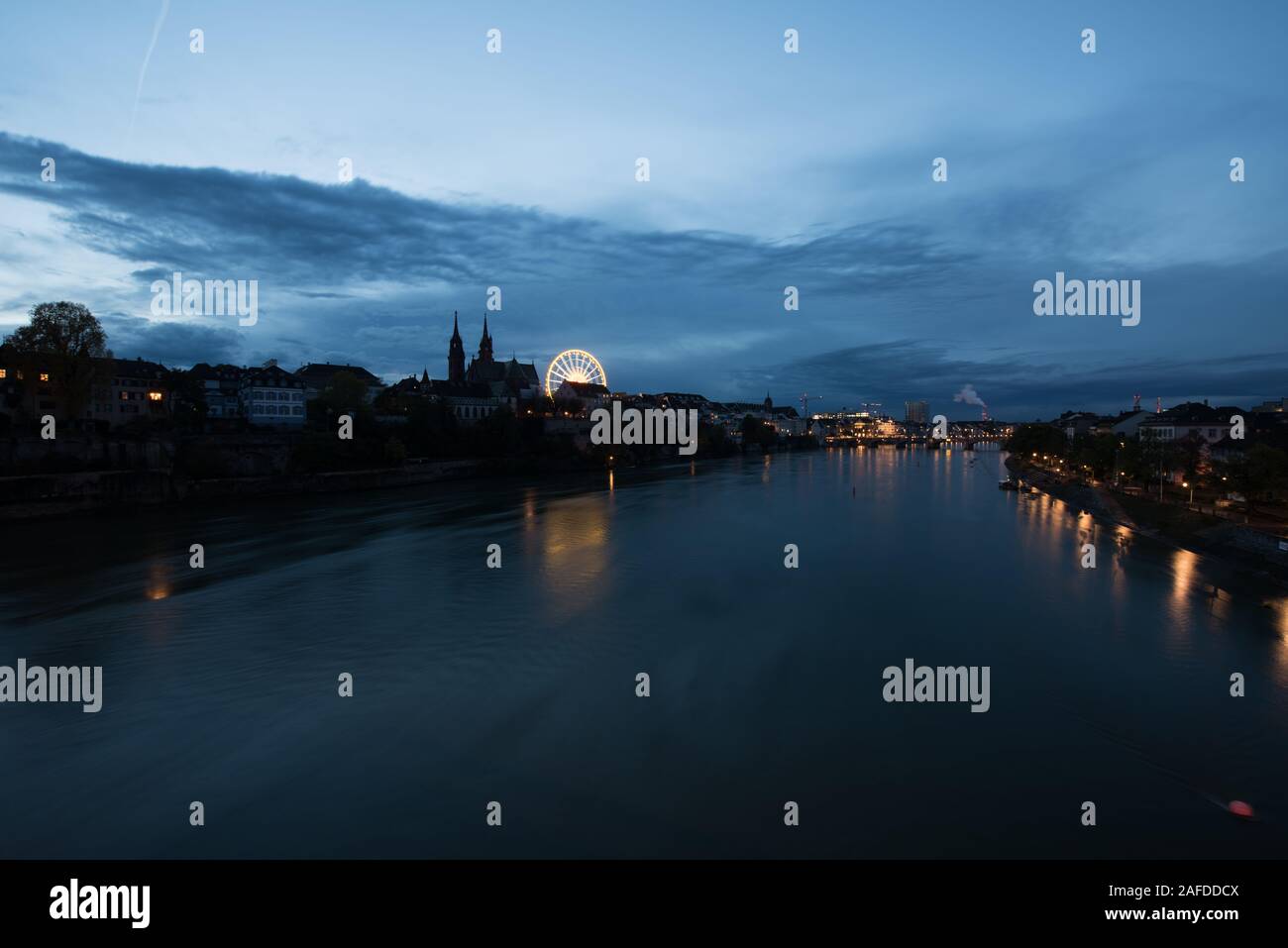 Basel Switzerland at night over the Rhine river Stock Photo - Alamy