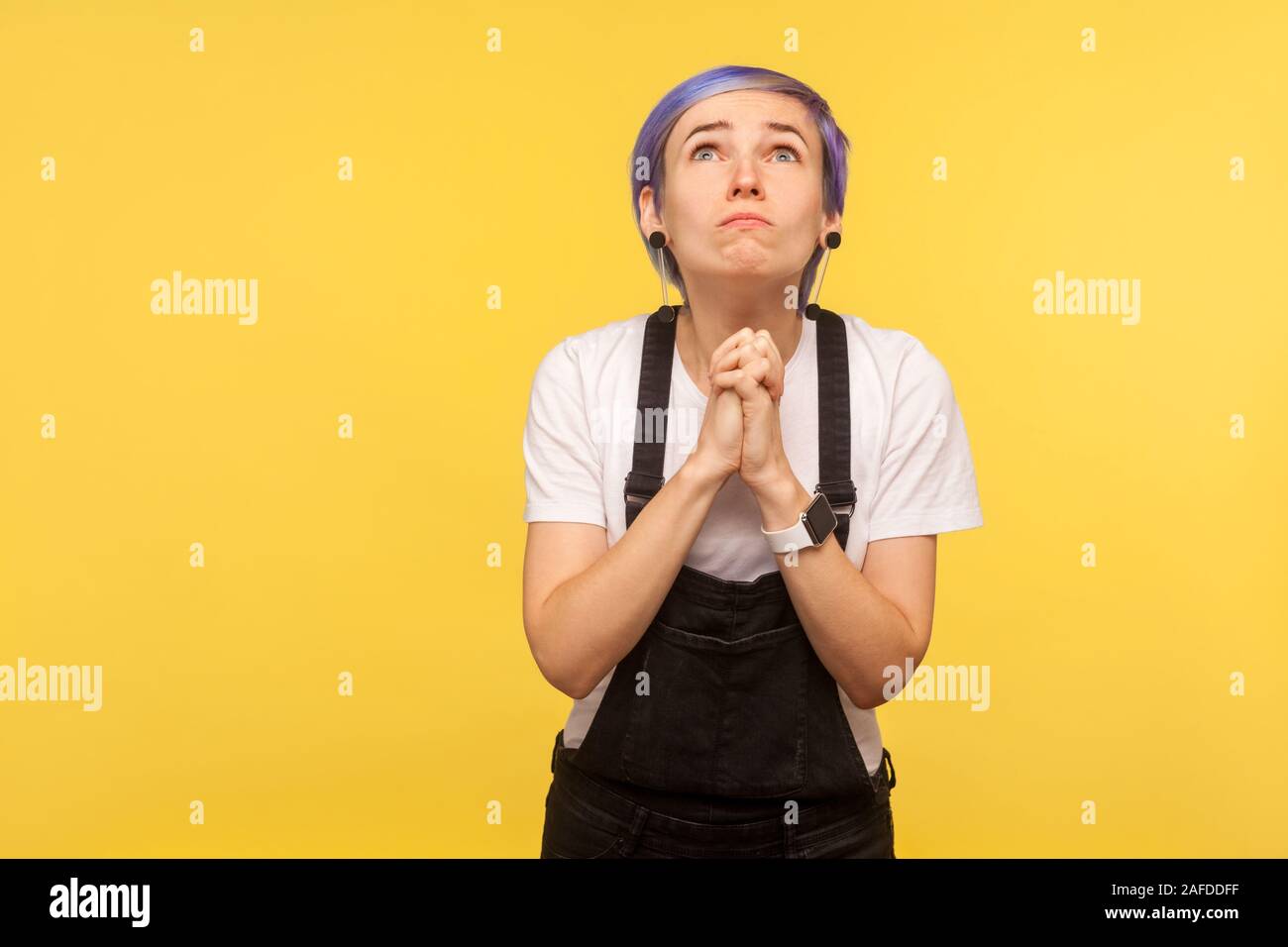 Please, I'm begging! Portrait of hipster woman with violet short hair ...