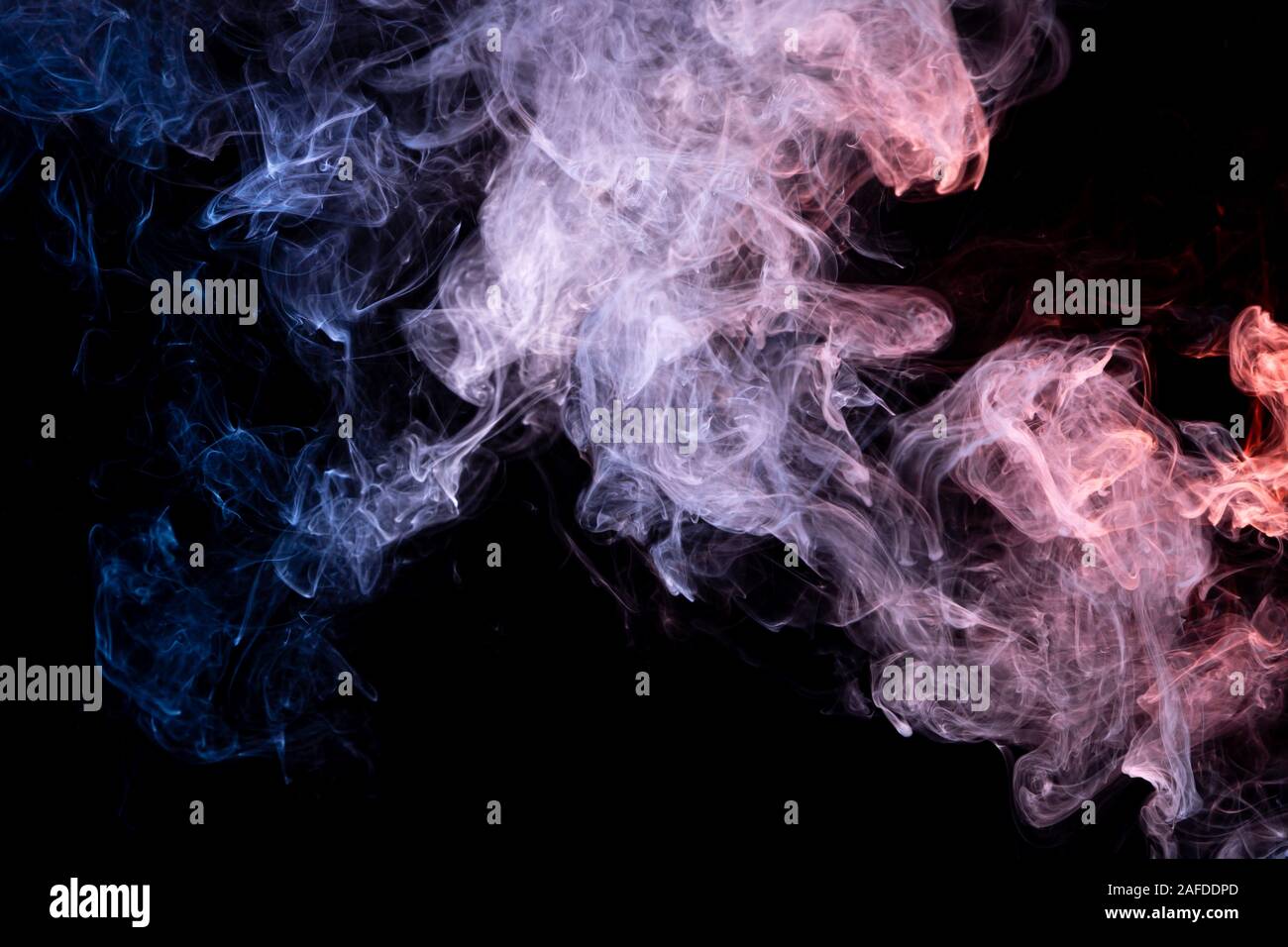 Abstract art blue and red colored smoke on black isolated background ...