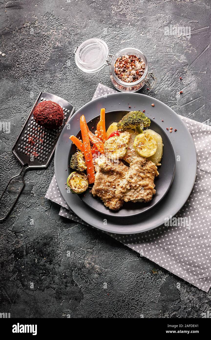 Baked cod steak with vegetables. Healthy and tasty food. Traditional ...