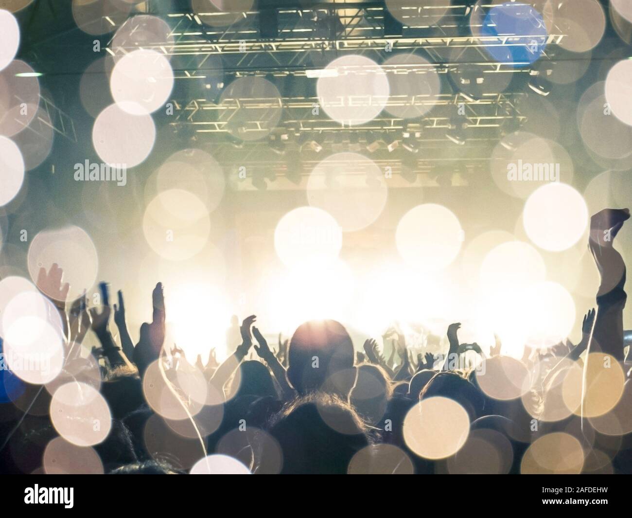 Concert hall with many concert attendants clapping in front of the ...