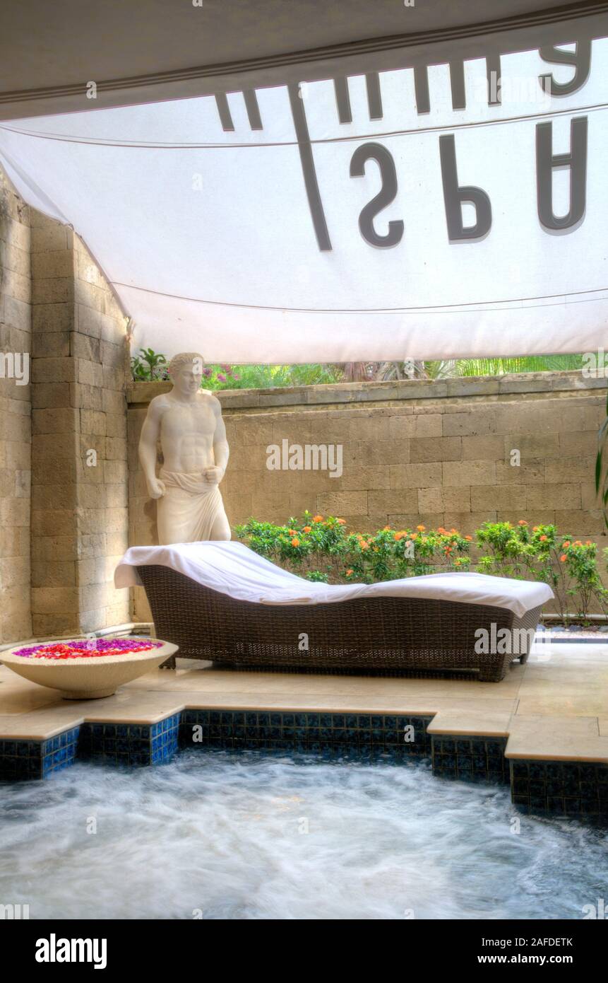 indoor spa with plunge pool and fountains and reclining lounge chairs ...