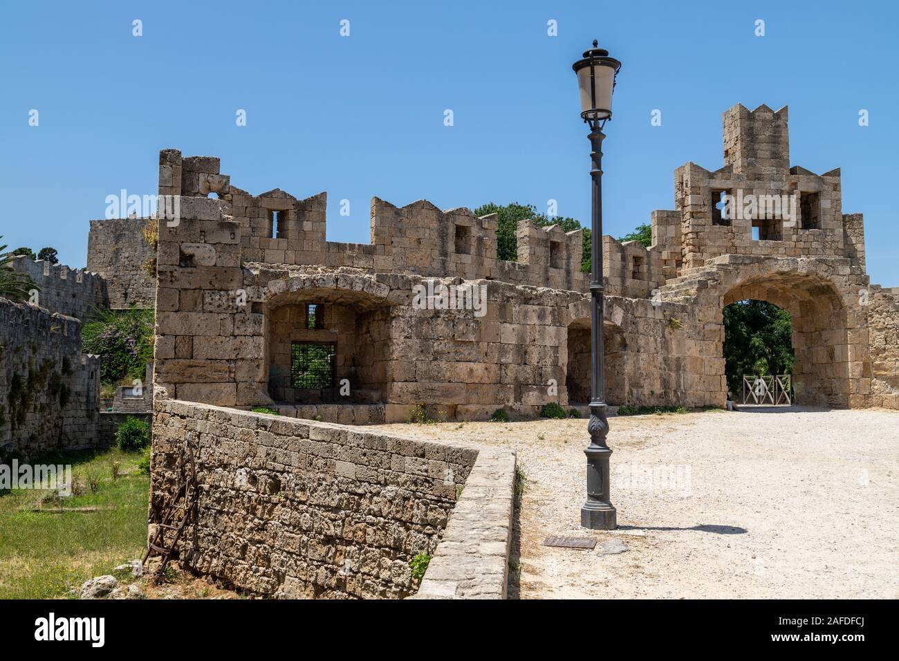 Part of the antique city wall in the old town of Rhodes city on Greek ...