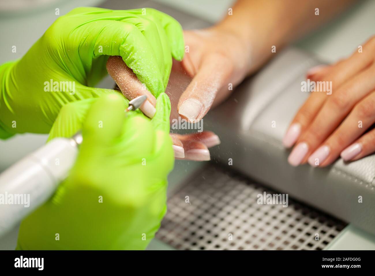 Female manicurist doing manicure hardware hi-res stock photography and ...