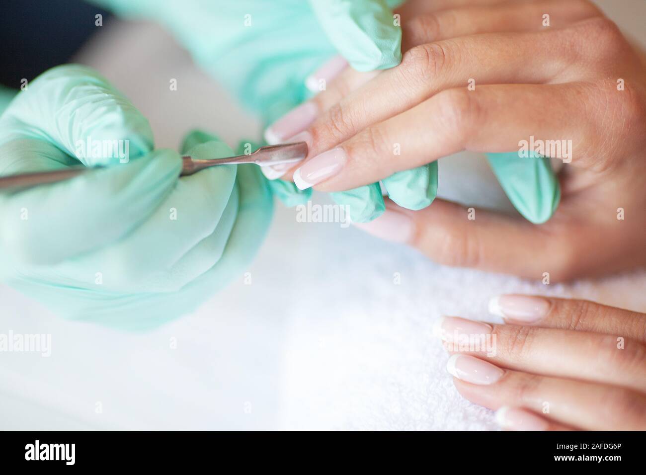 Female manicurist doing manicure hardware hi-res stock photography and ...
