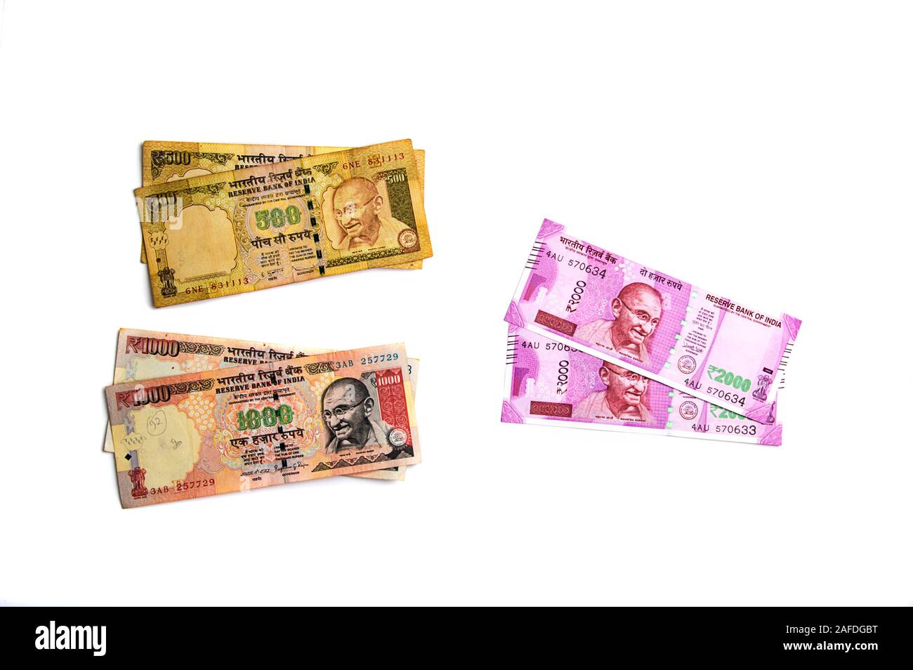 New Indian Currency of Rs.2000 and old currency of Rs.1000 on white ...