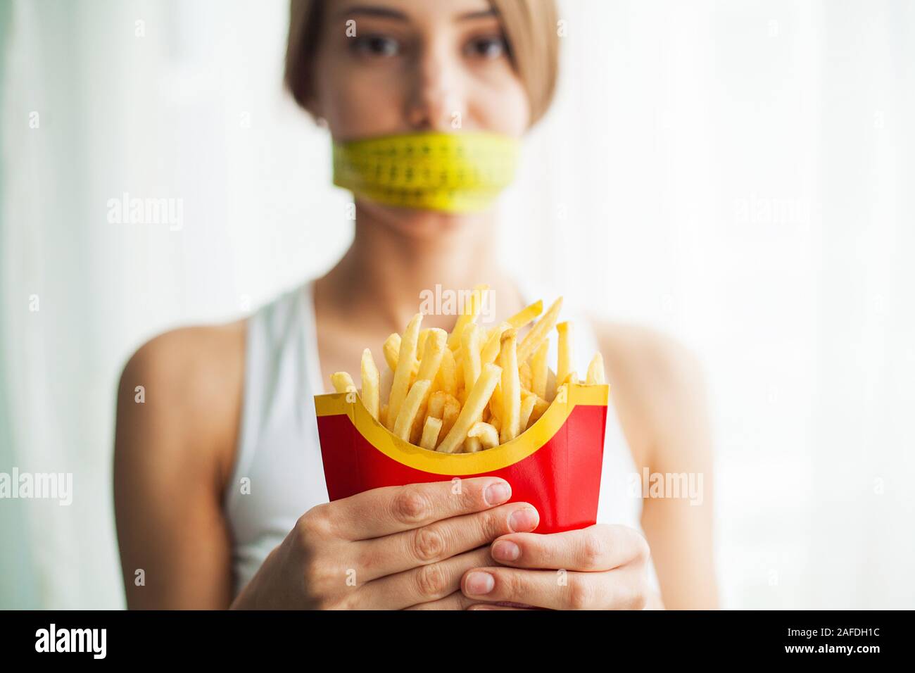 Cheerful women eating chips hi-res stock photography and images - Alamy