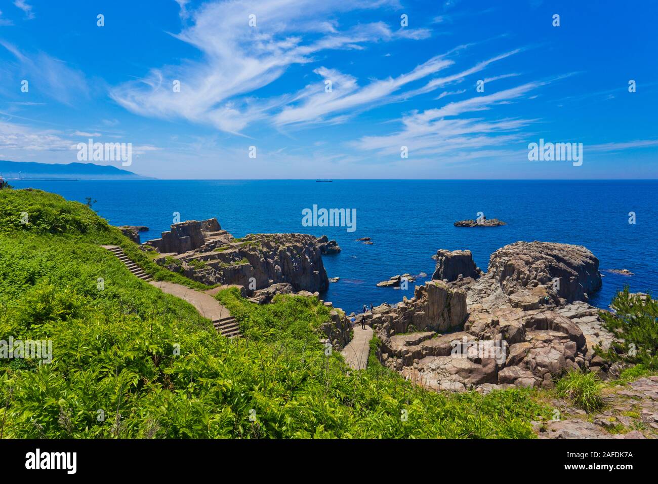 Scenery of Tojinbo cliff and tojinbo tower in Fukui prefecture, Japan ...