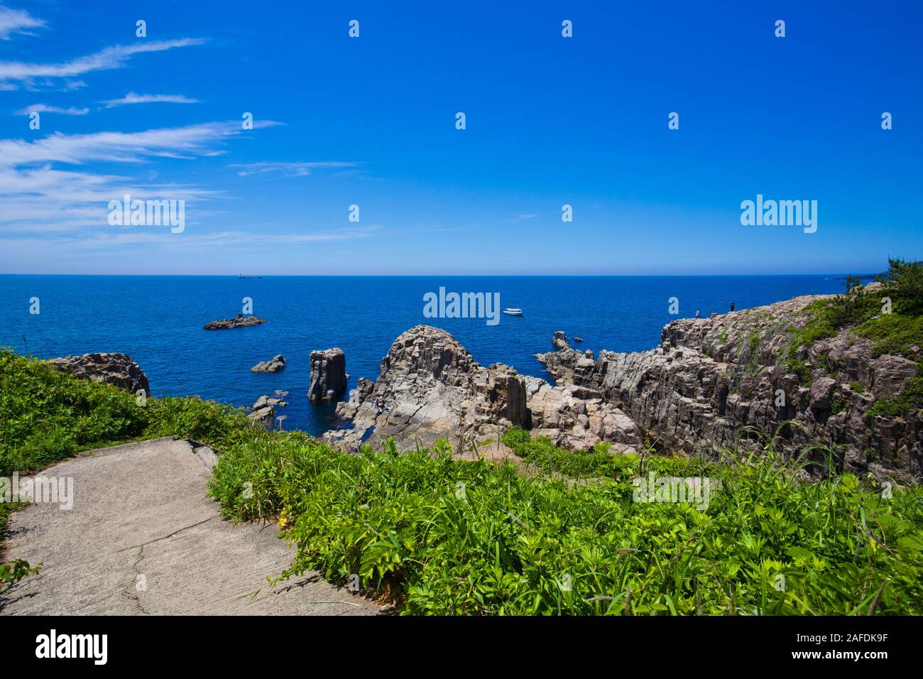 Scenery of Tojinbo cliff and tojinbo tower in Fukui prefecture, Japan ...