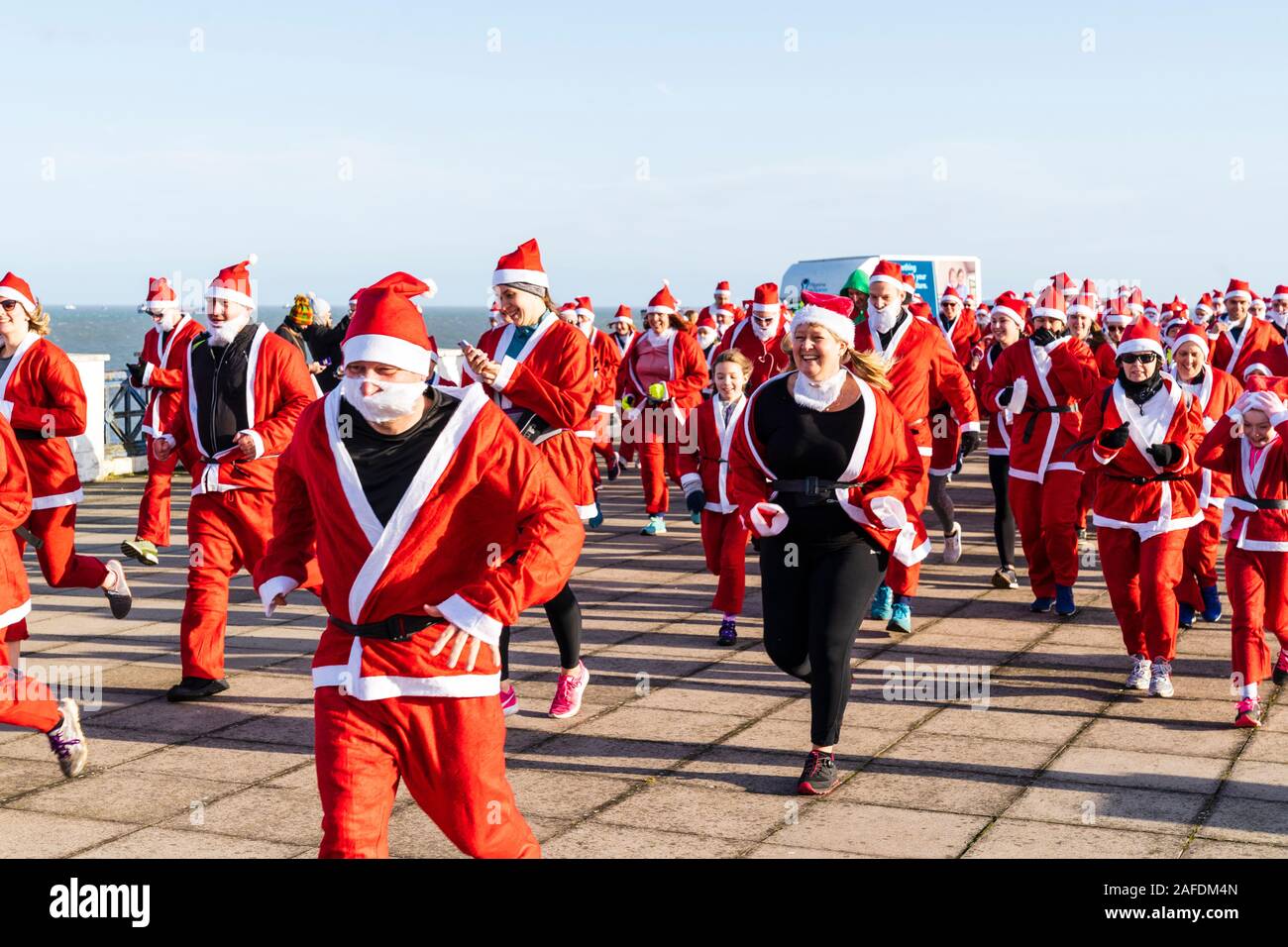 Large group of people all dressed up as Father Xmas, gathered on Margate seafront for the yearly ...