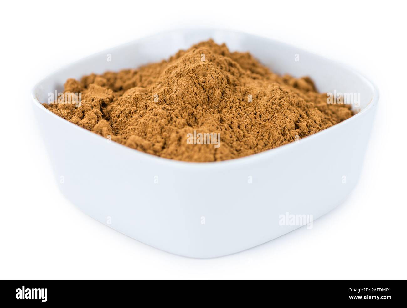 Portion of Cinnamon (as close-up shot) isolated on white background ...