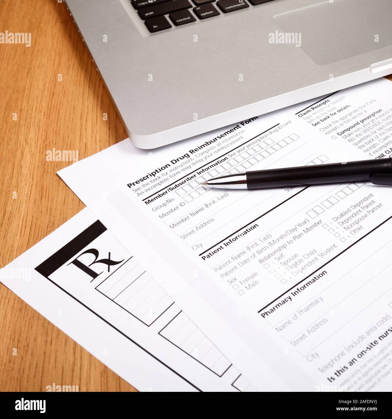 Prescription form with pen and laptop computer Stock Photo - Alamy