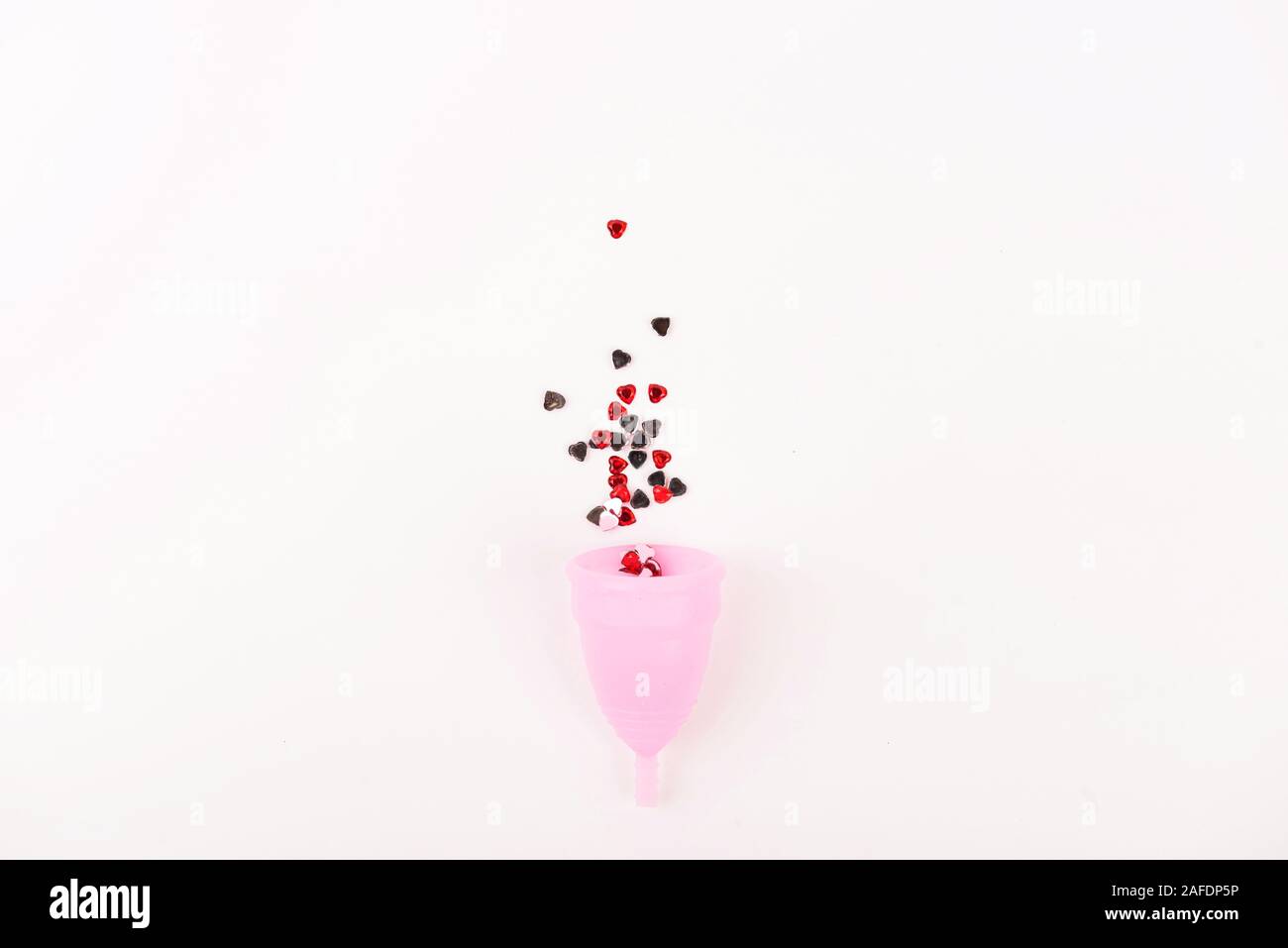 Menstrual Cup with red glitter on white background, concept of women's ...