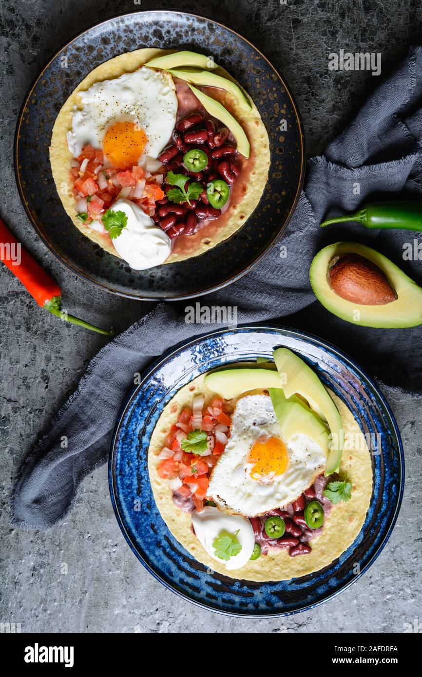 Delicious Huevos Rancheros Tostadas, Mexican breakfast consisting of ...