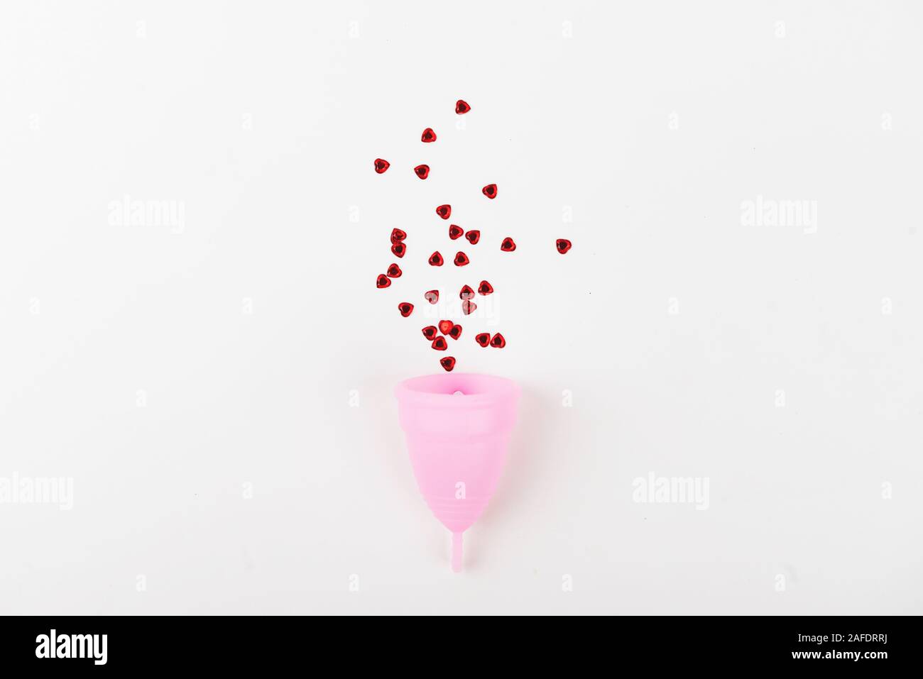 Menstrual Cup with red glitter on white background, concept of women's ...