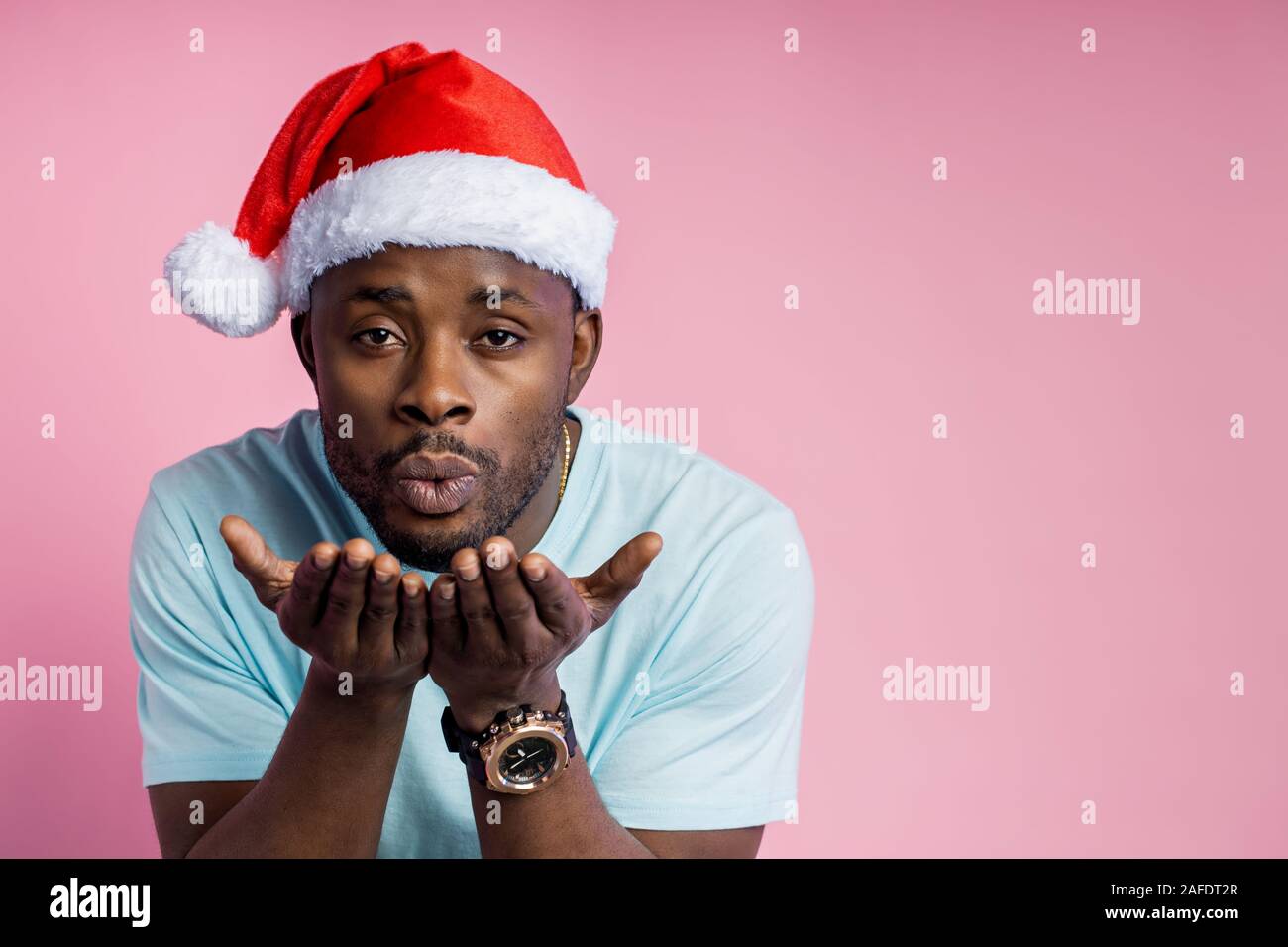 Handsome guy blowing air kiss hi-res stock photography and images - Alamy