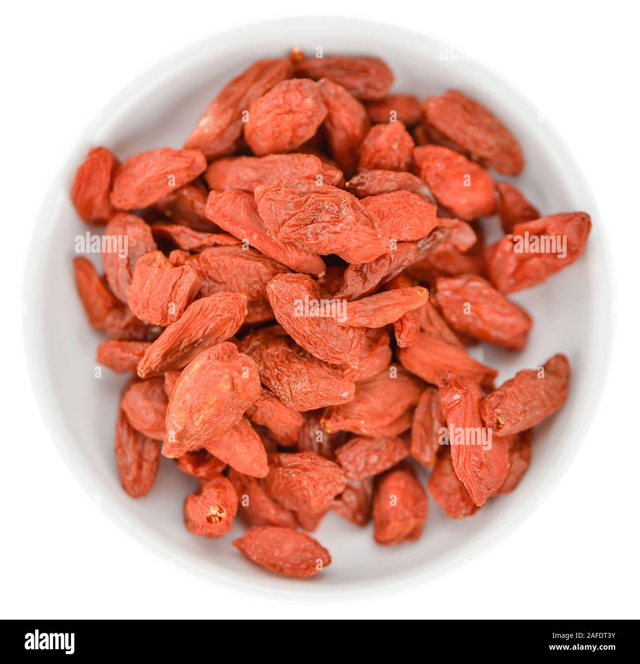 Portion of Goji Berries (as close-up shot) isolated on white background ...