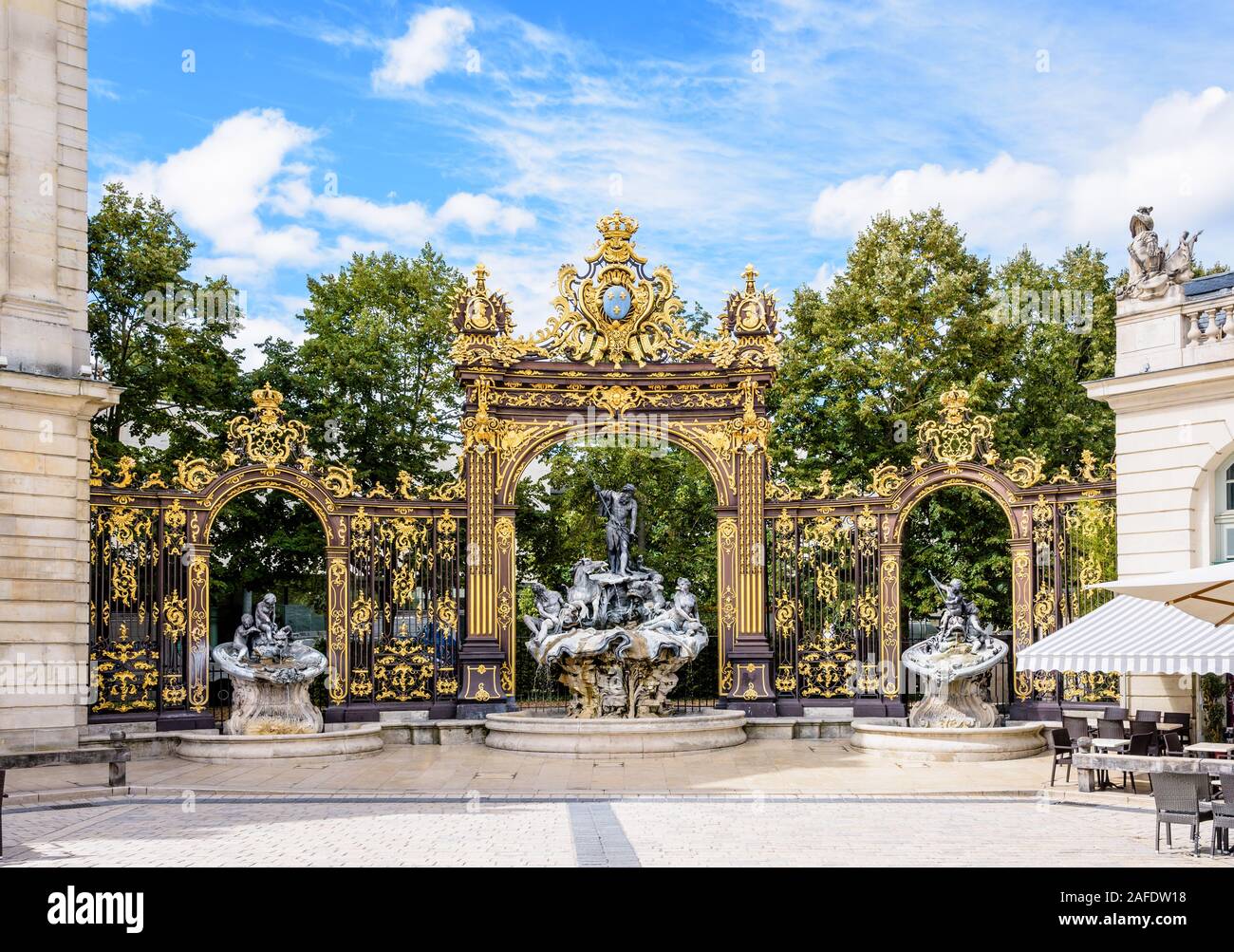 The fountain of Neptune in the Rococo style and the gilded wrought iron ...