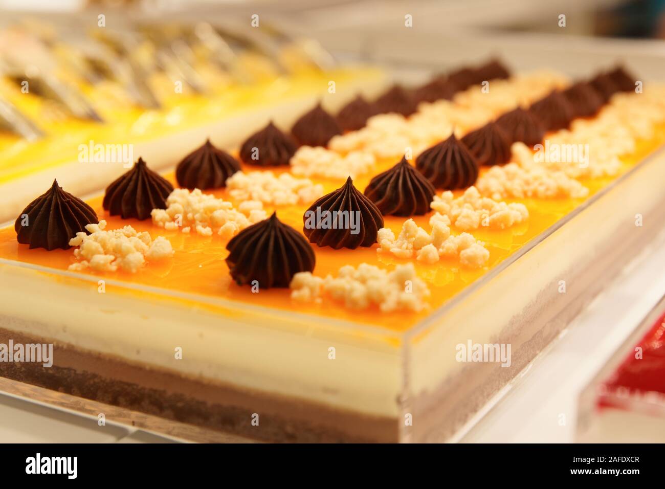 Layer cake with fruit gel and ganache, close-up Stock Photo - Alamy