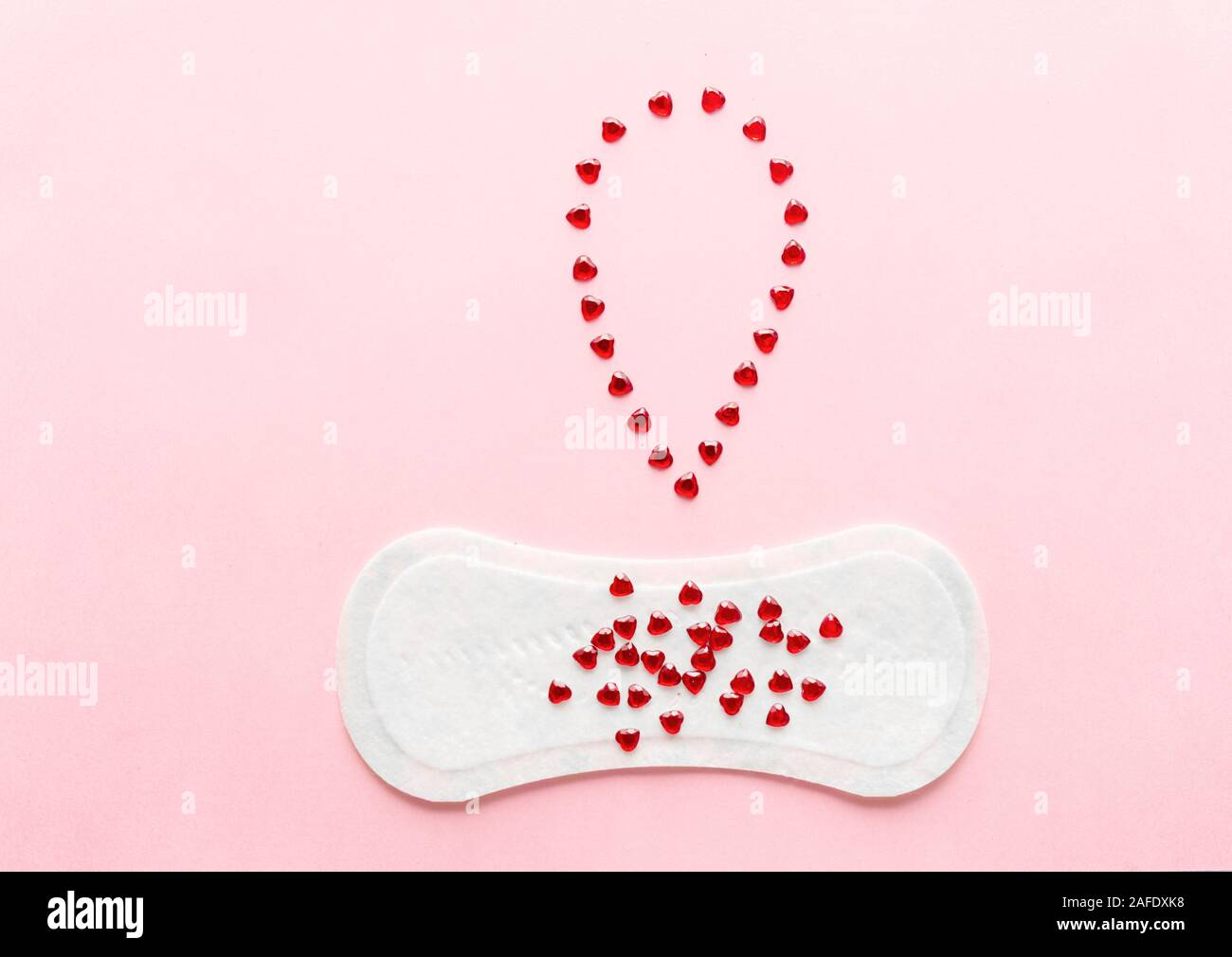 Feminine hygiene pad on a pink background. Concept of feminine hygiene ...